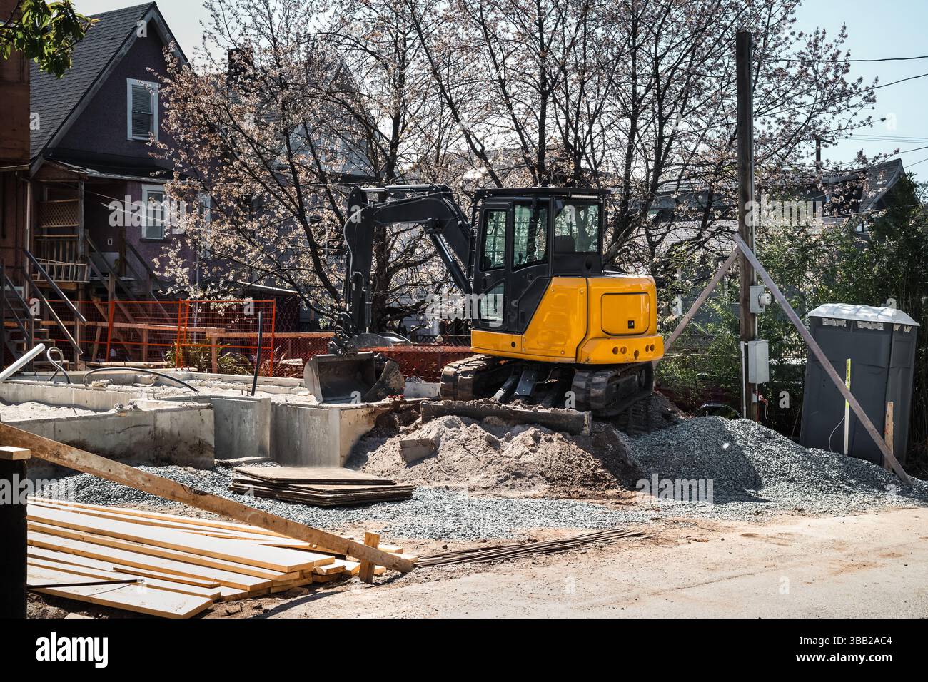 Bulldozer in front of building foundation. Yellow bulldozer on top of ...