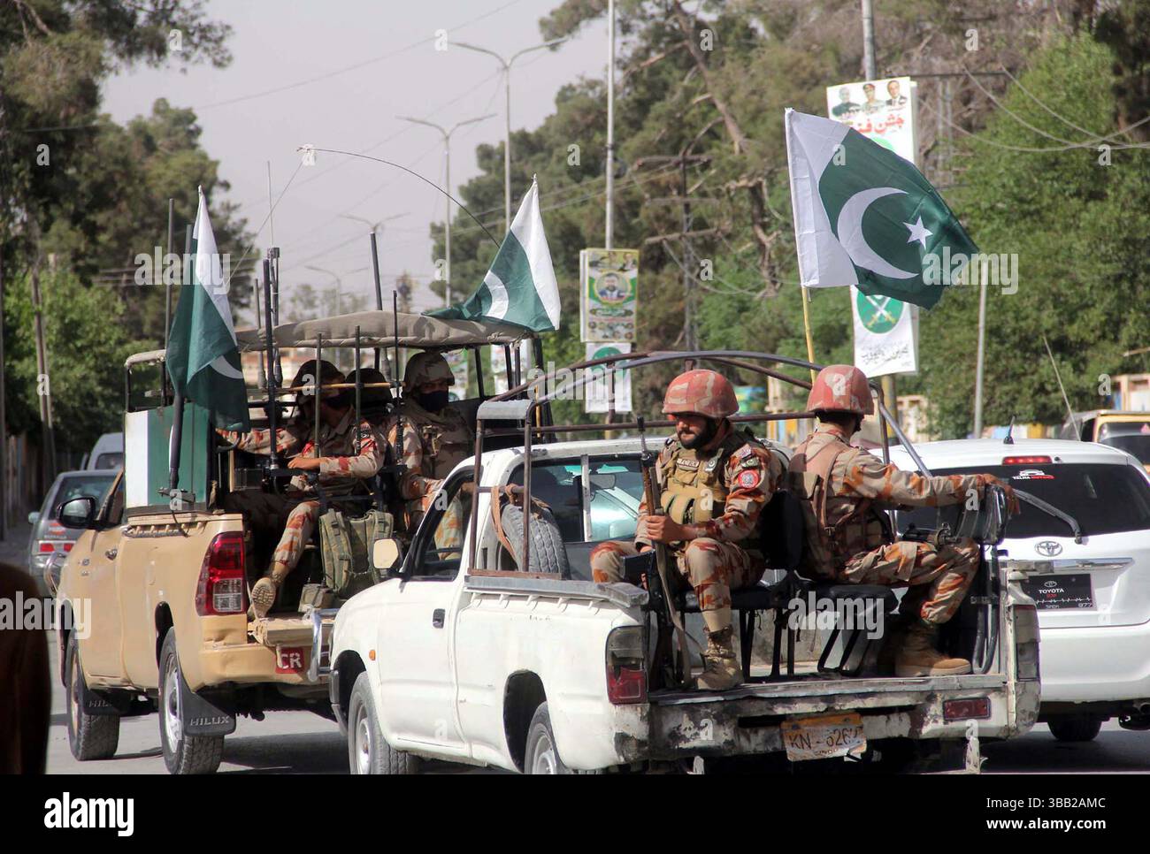Frontier Corps (FC) convoy patrol in city during flag march for ...