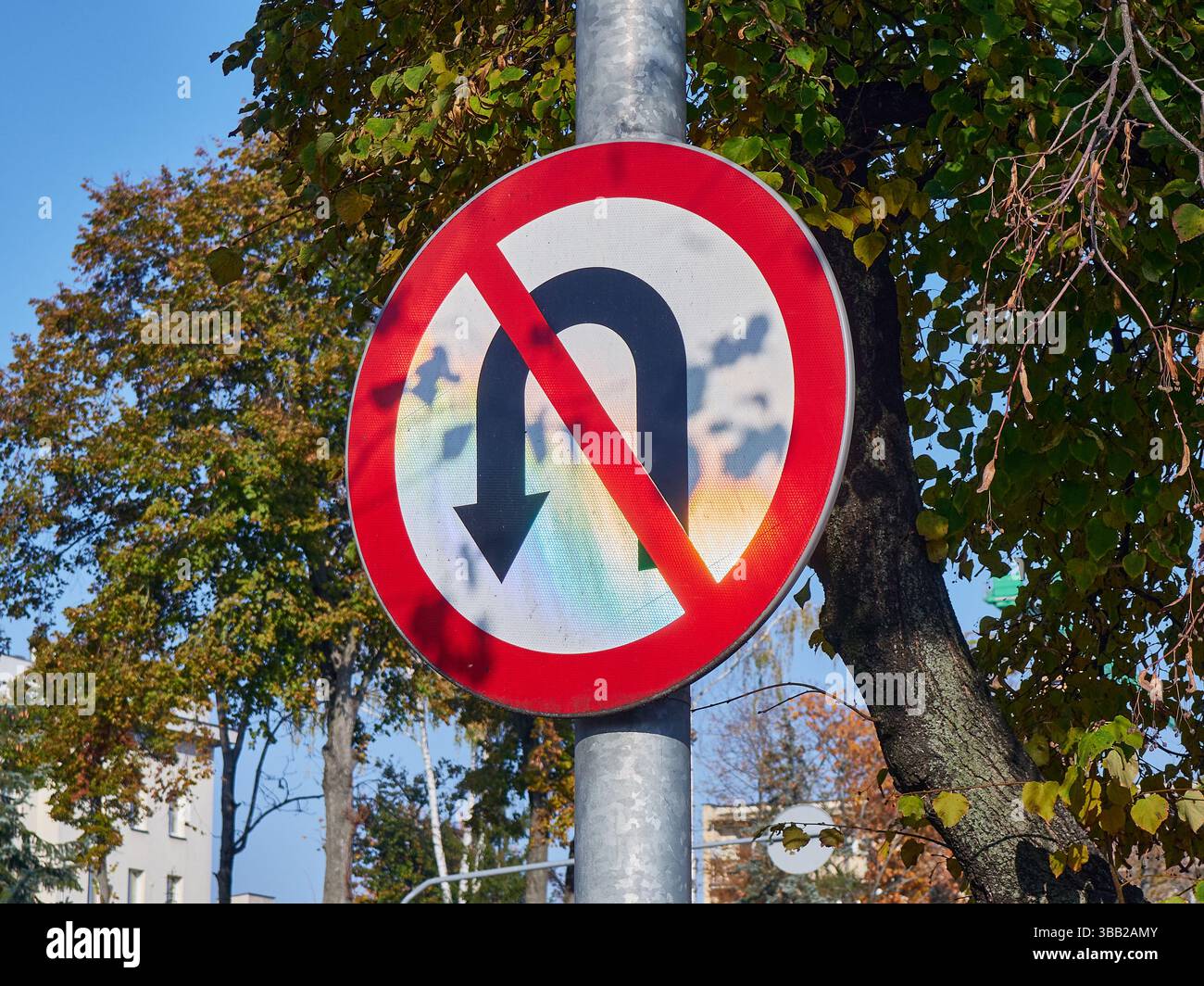 No U-Turn Road Sign Against Autumnal Trees Stock Photo - Alamy