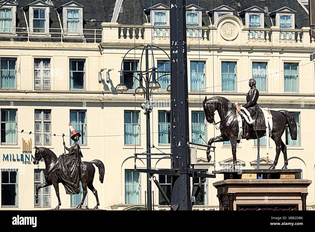 Glasgow, Scotland, UK. 14th May, 2025. Prince albert statue hoisted ...