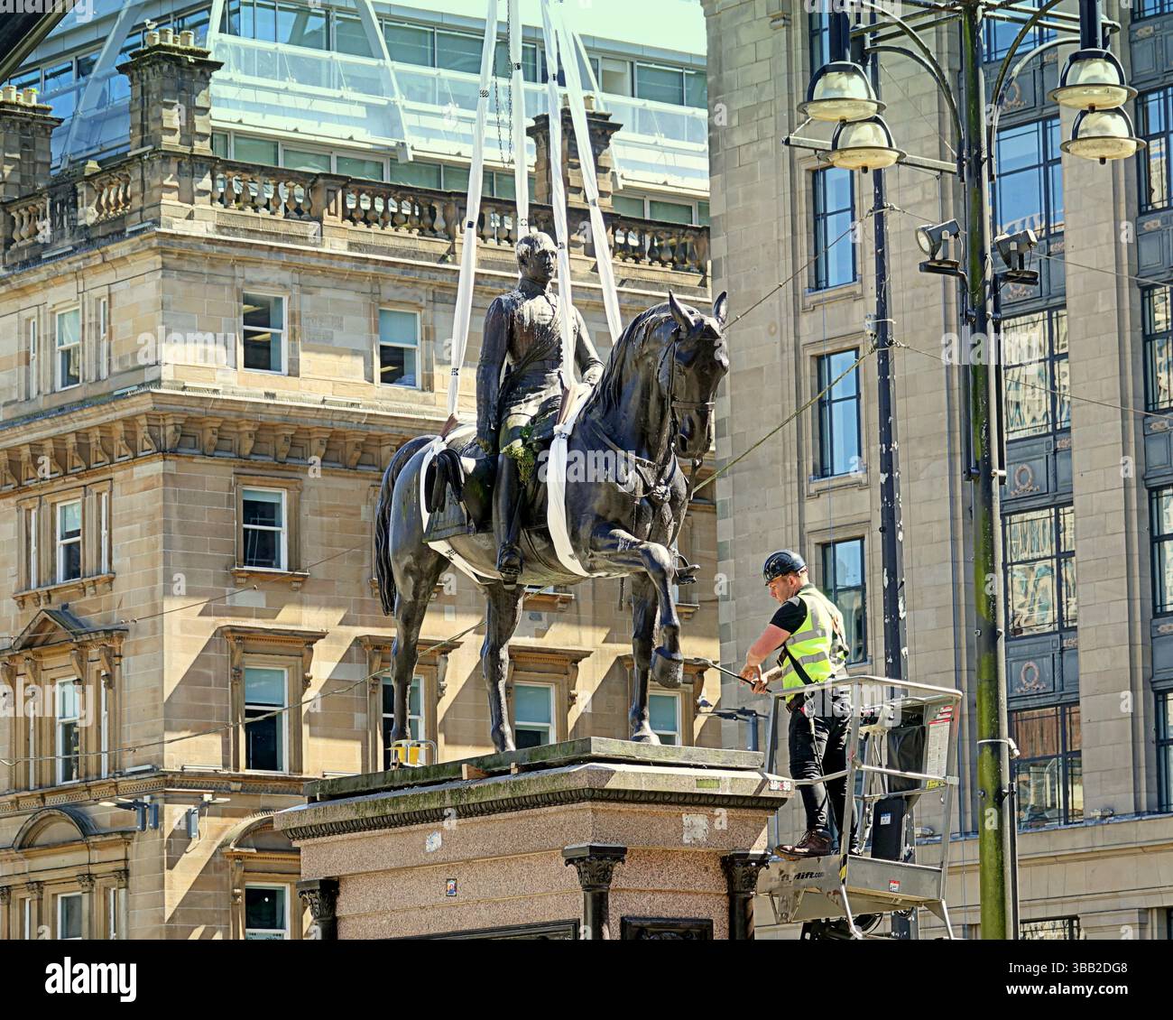 Glasgow, Scotland, UK. 14th May, 2025. Prince albert statue hoisted ...
