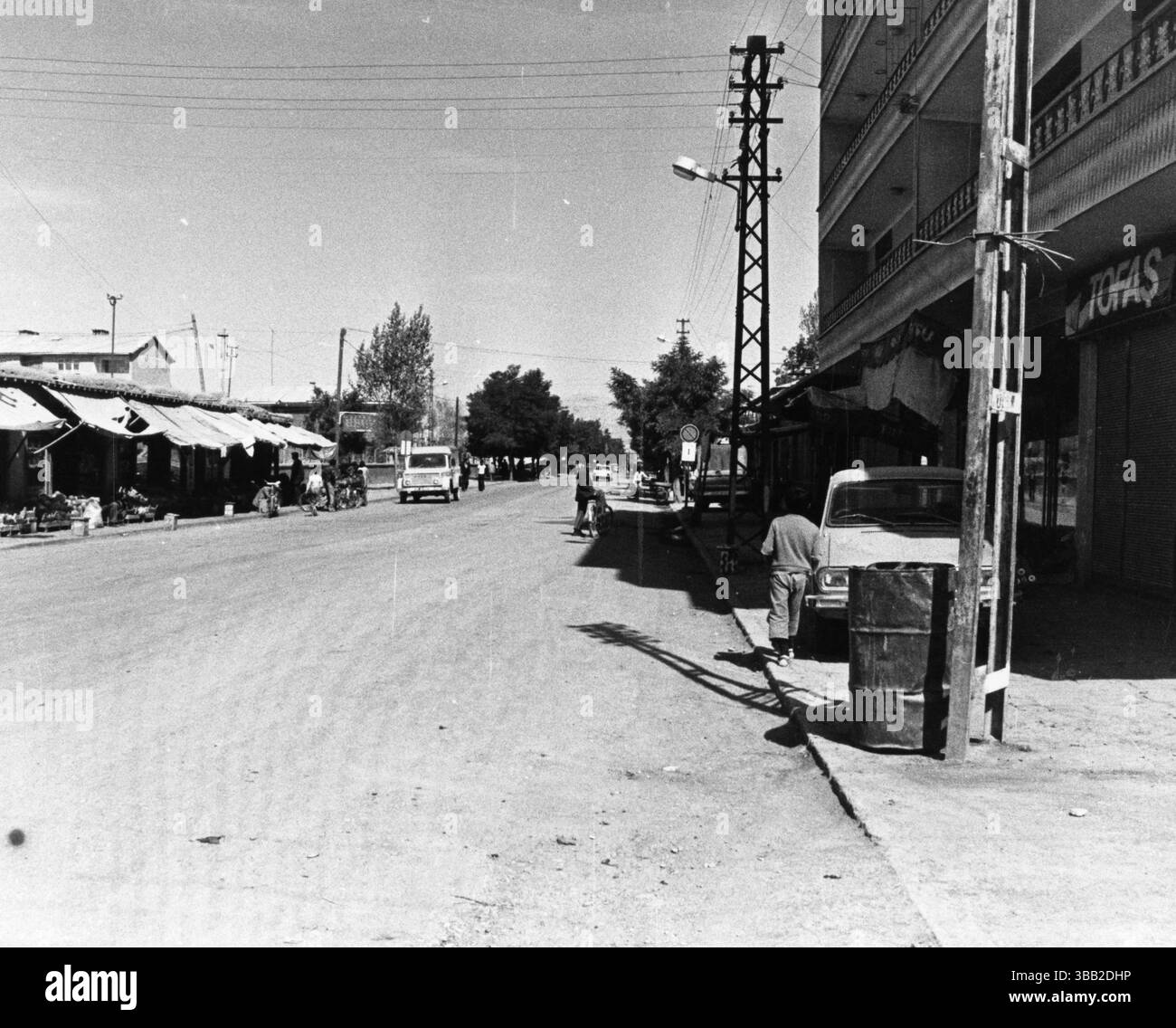 People and vehicles in the main street of the modern city of Van ...