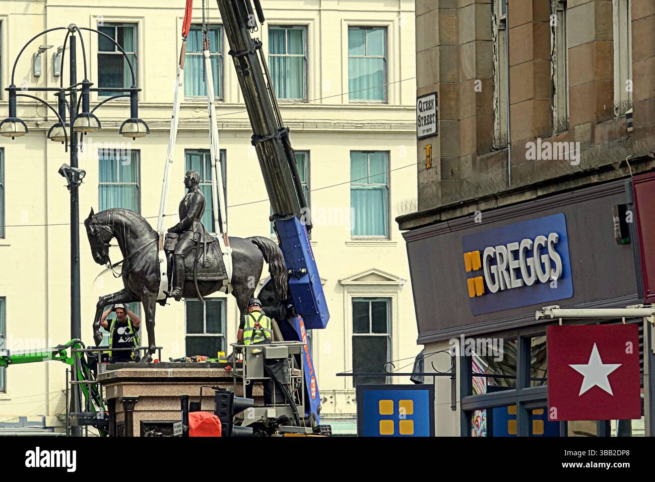 Glasgow, Scotland, UK. 14th May, 2025. Prince albert statue hoisted ...