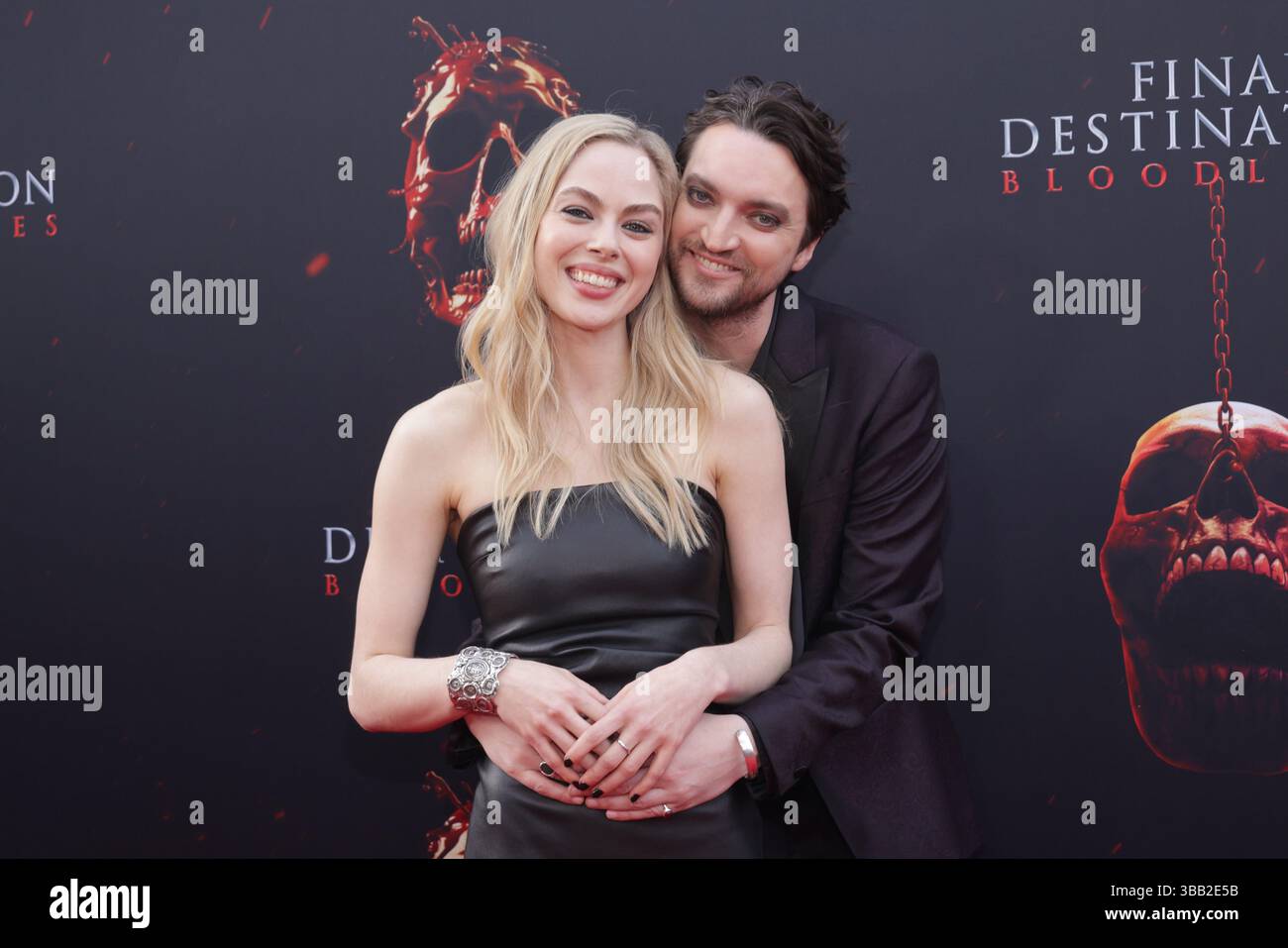 Sarah Dugdale and Richard Harmon attends the world premiere of Warner ...