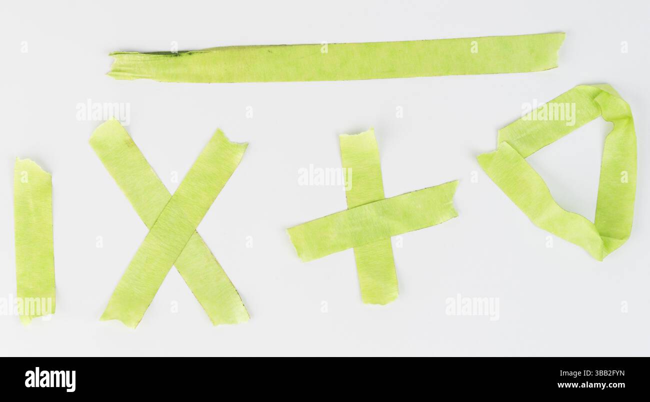 Variety of green tape pieces arranged on white background, creating ...