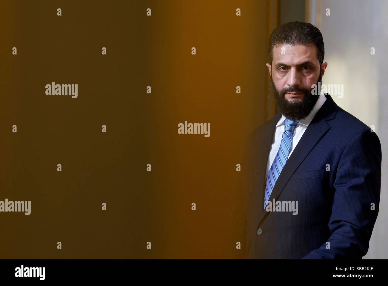 FILE - Syria's interim president, Ahmad al-Sharaa, listens during a joint press conference with ...