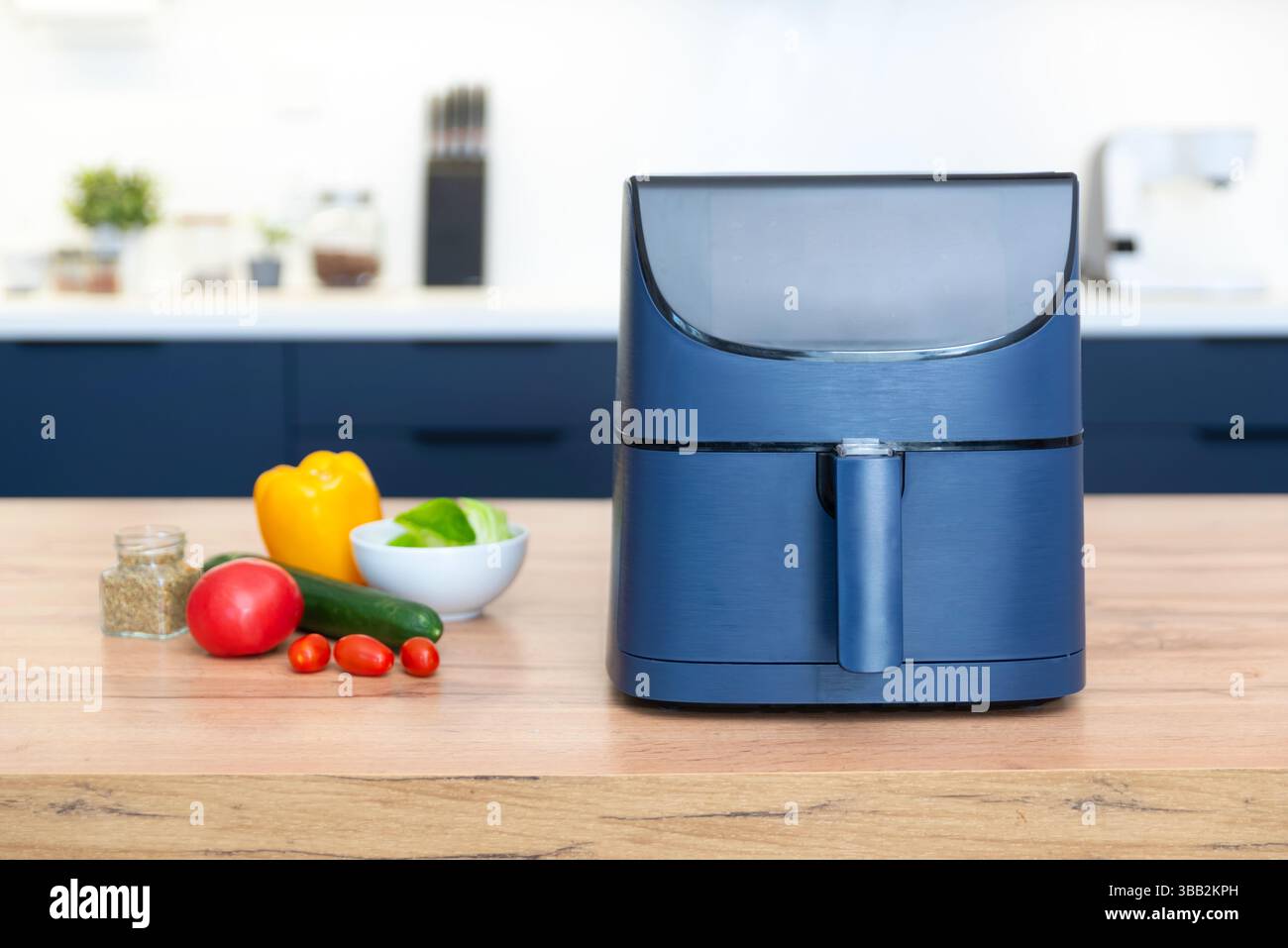 Air fryer machine in the kitchen. Healthy food Stock Photo - Alamy