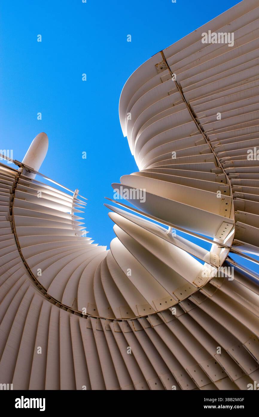 A white spiral, metal cover for a roof. Conceptual, abstract ...