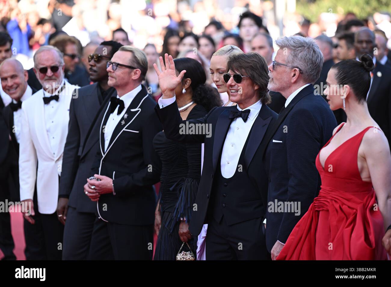 Tom Cruise (waving) attends the premiere for Mission: Impossible - The ...