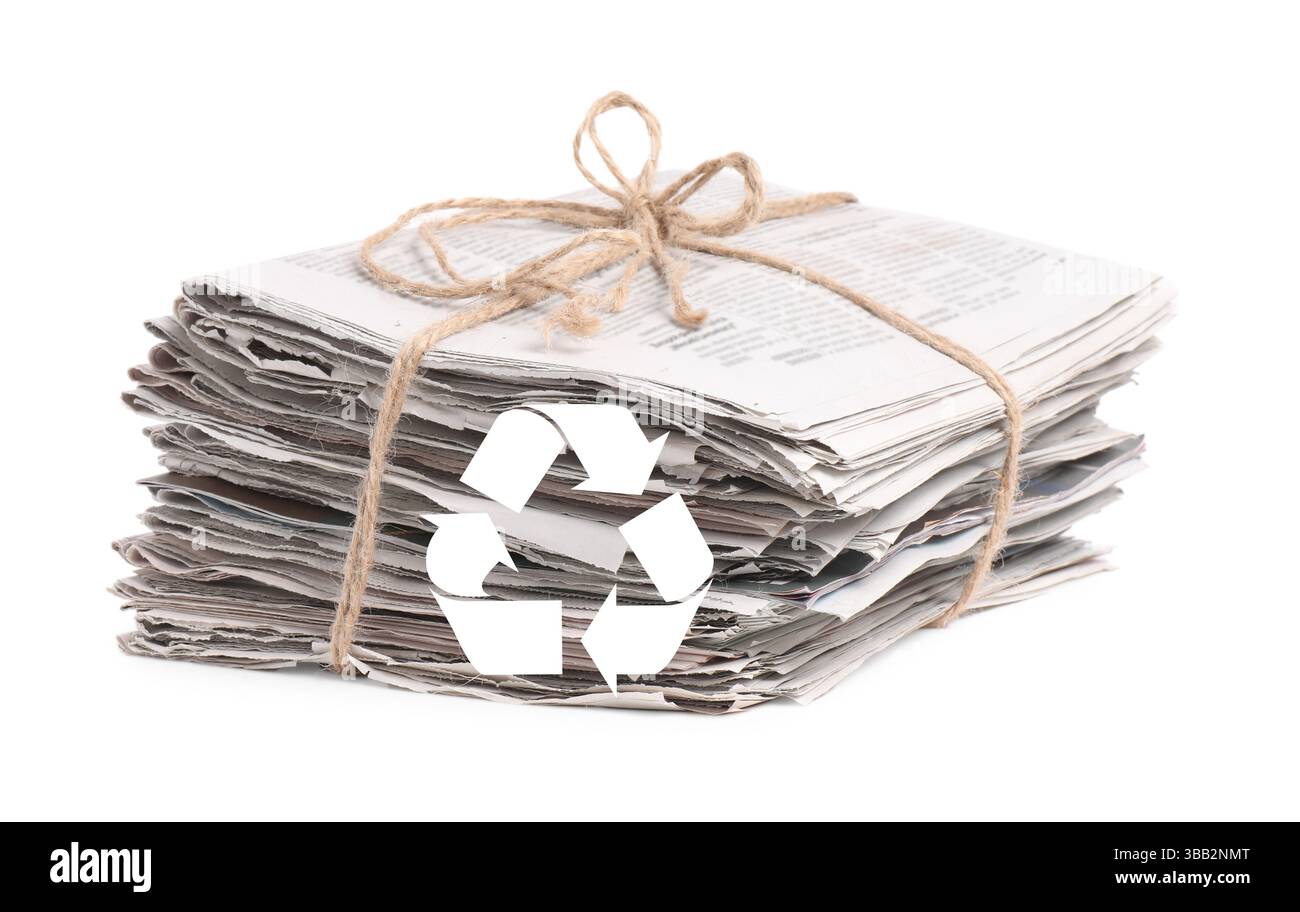 Recycling symbol and stack of tied newspapers on white background. Eco ...