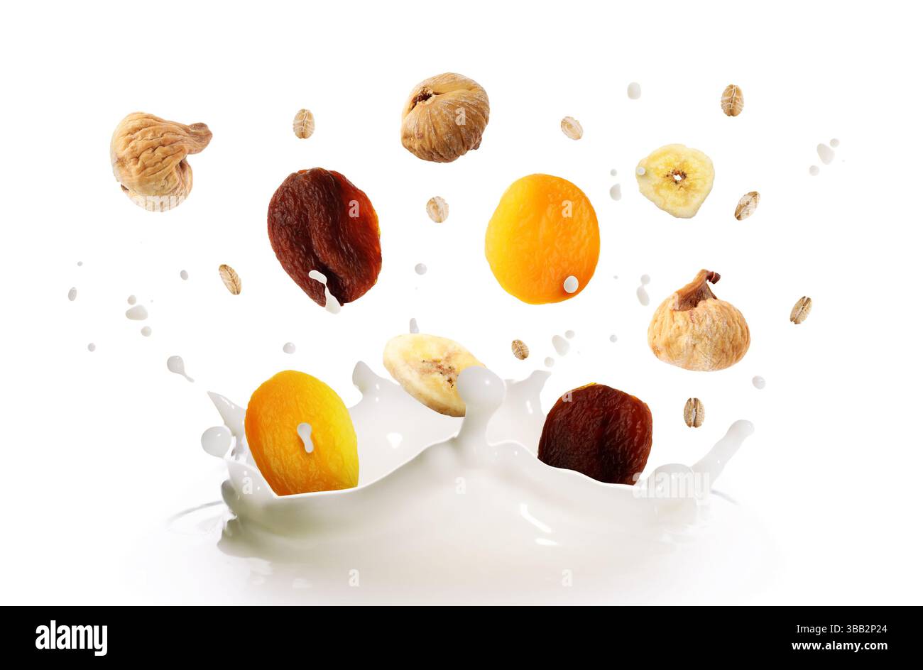 Milk splash with oat flakes and dried fruits in air on white background ...