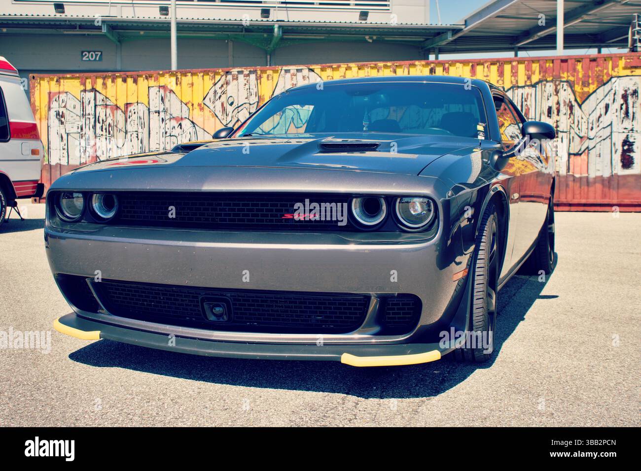 Aggressive Dodge Challenger SRT in Urban Show Setting Stock Photo - Alamy