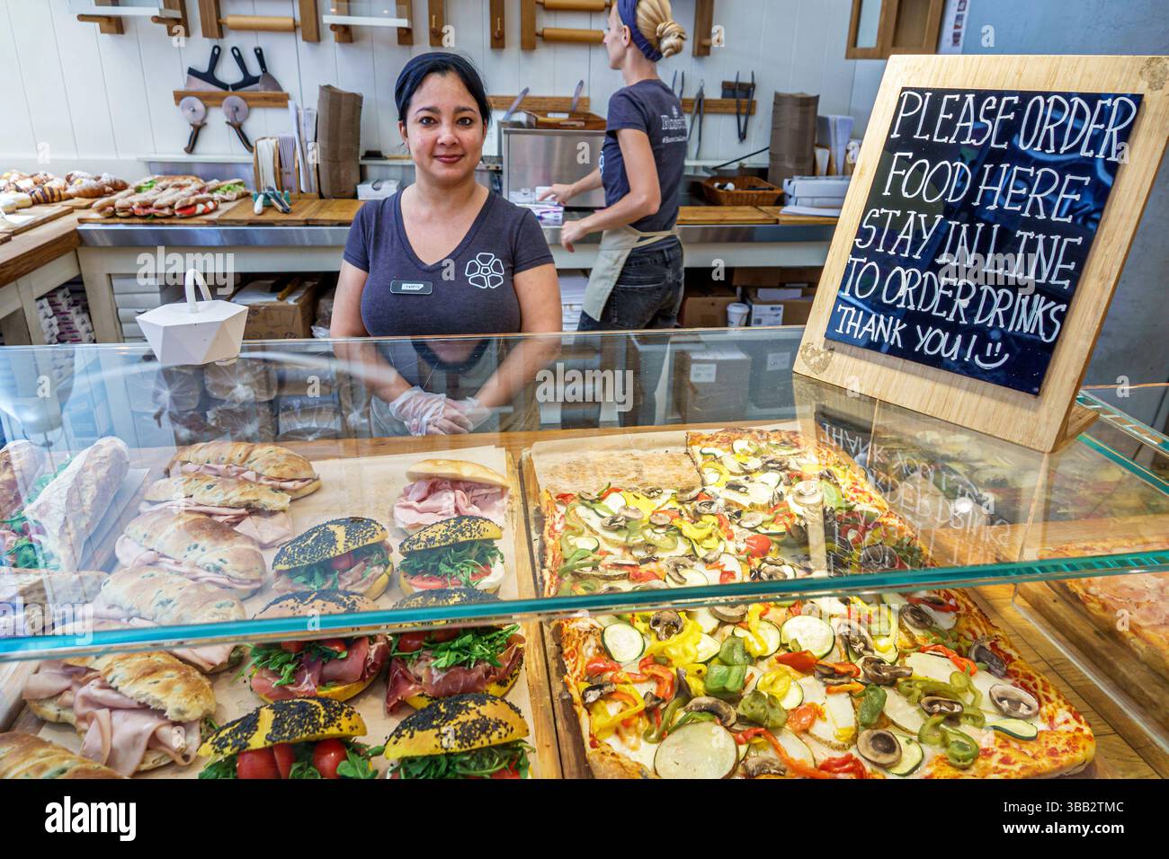 Latina restaurant employee smiling in hi-res stock photography and ...