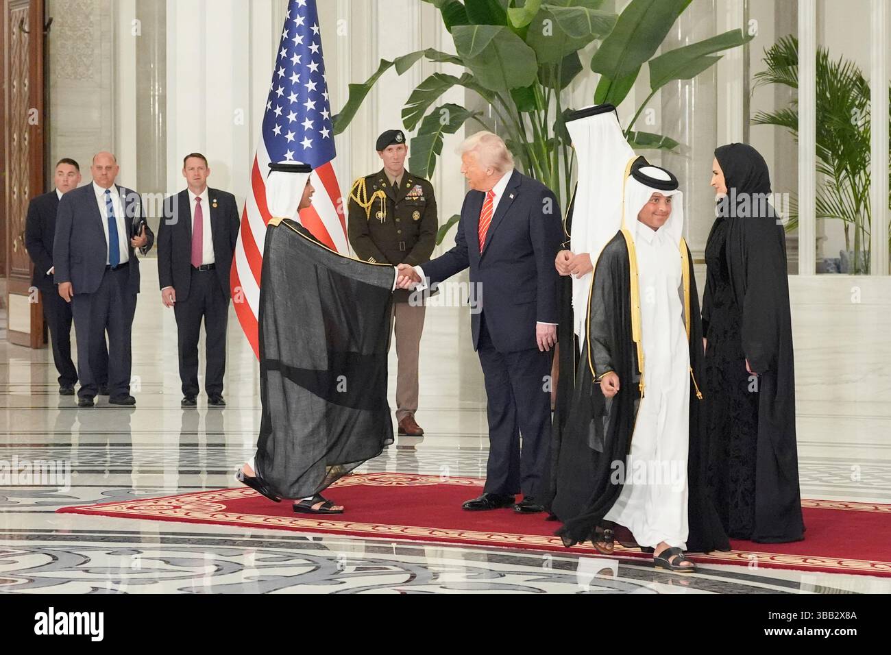 President Donald Trump greets Qatari delegations with Qatar's Emir ...