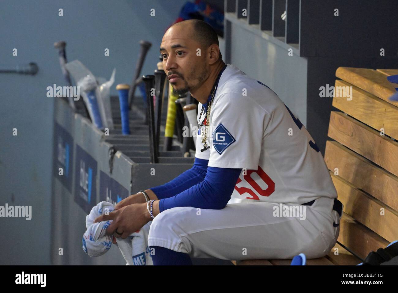 Los Angeles Dodgers shortstop Mookie Betts sits in the dugout during a ...