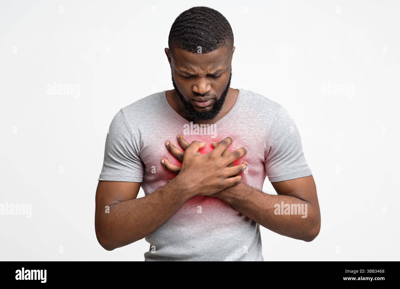 Sad young man suffering from acute pain in chest Stock Photo - Alamy