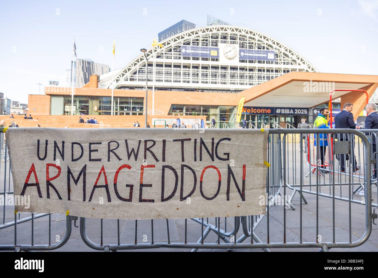 Manchester, UK. 14 MAY, 2025. "Underwriting armageddon" sign as ...