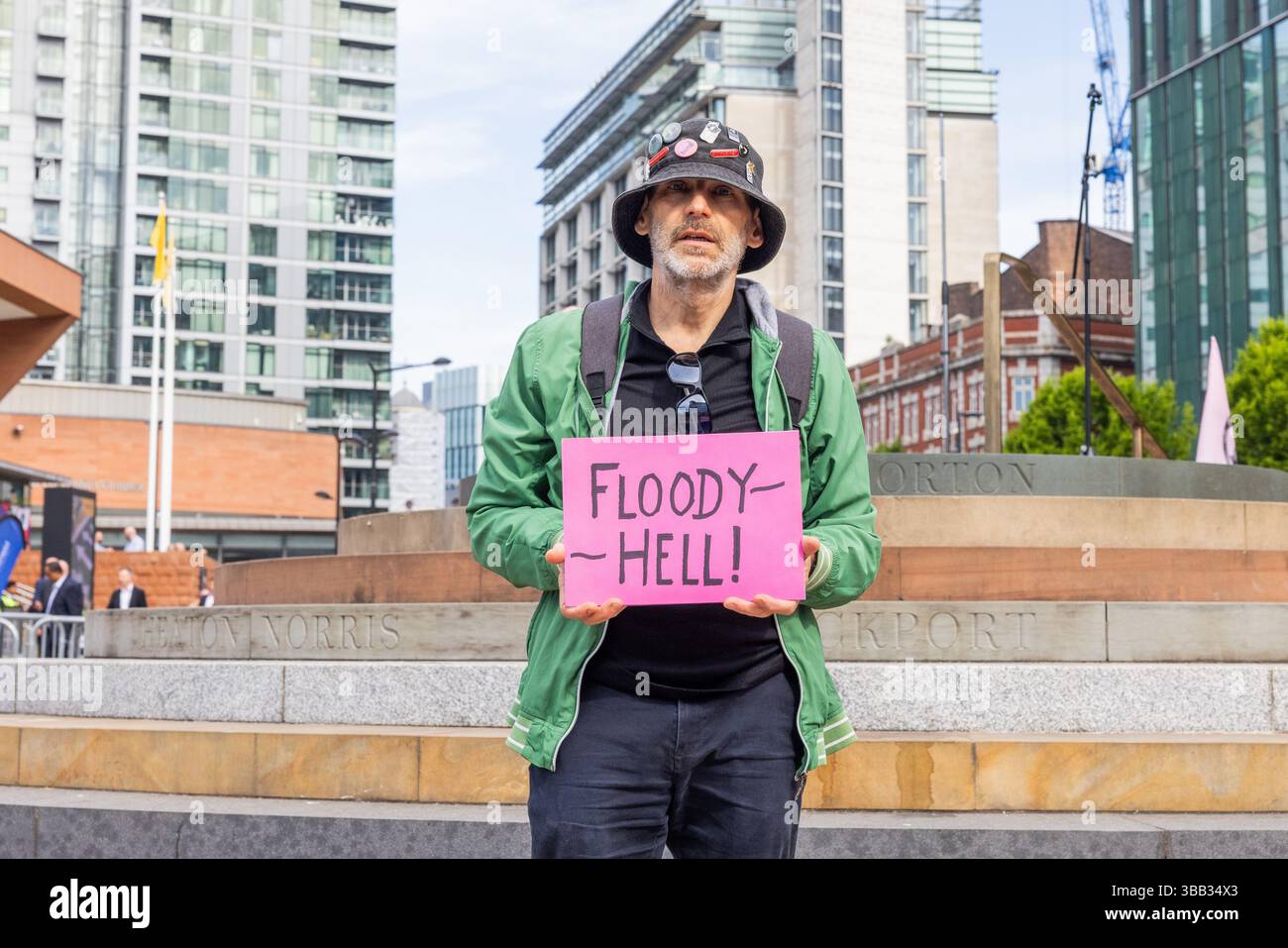 Manchester, UK. 14 MAY, 2025. Man holds "floody hell" sign as ...