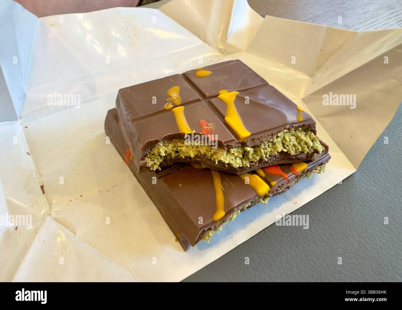 Unwrapped Chocolate Bar with Unusual Yellow and Red Filling Stock Photo ...