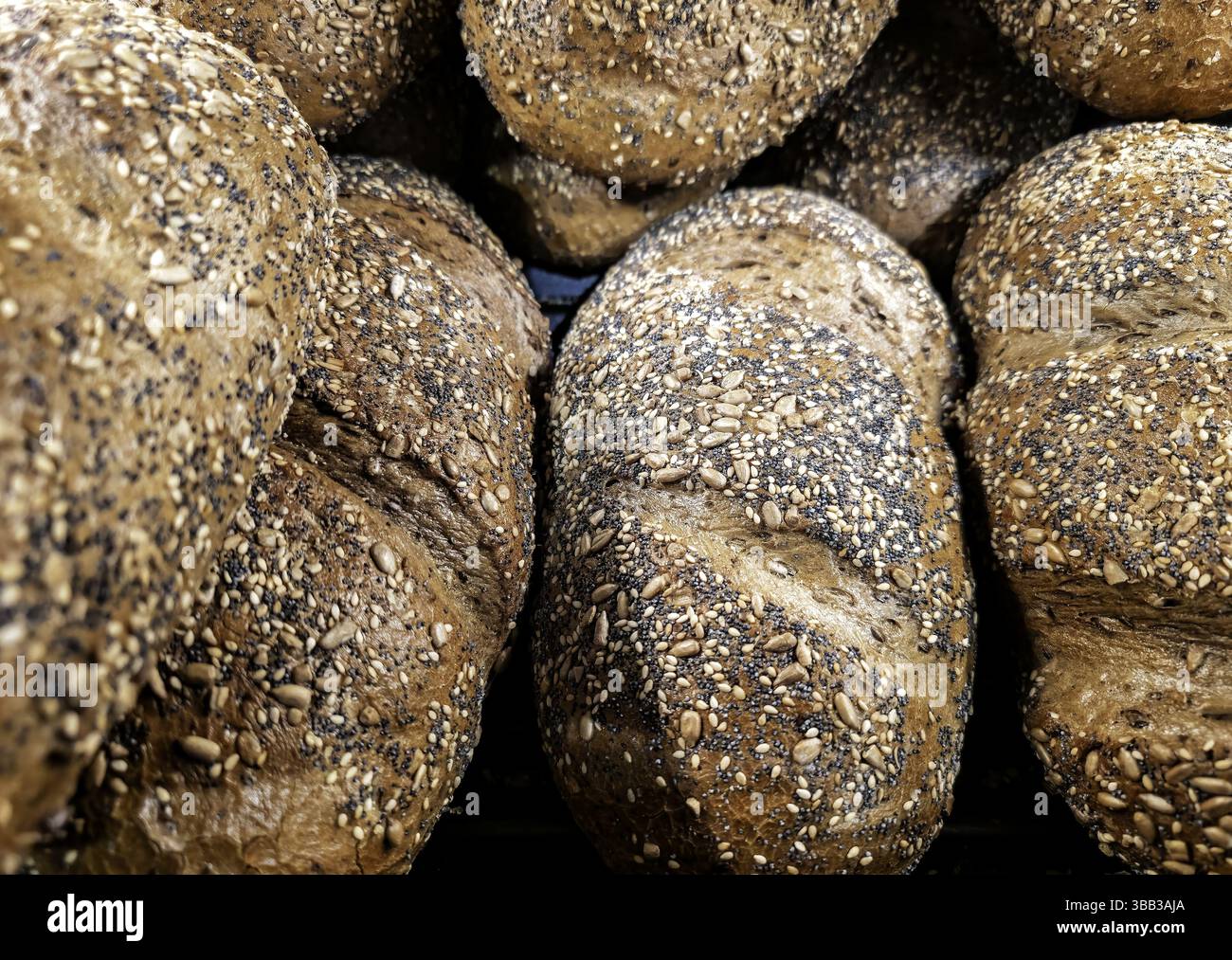 Artisanal whole grain seed bread in bakery, food and food Stock Photo ...