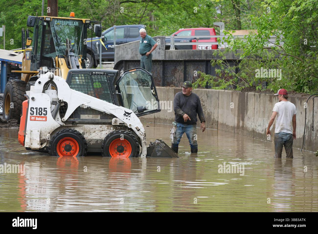 Work crews are trying to drain water as clean up continues after ...
