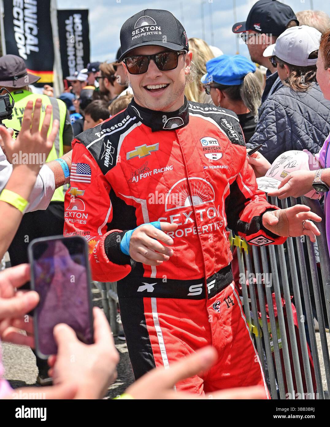 IndyCar driver Santino Ferrucci greets the fans at driver introductions ...