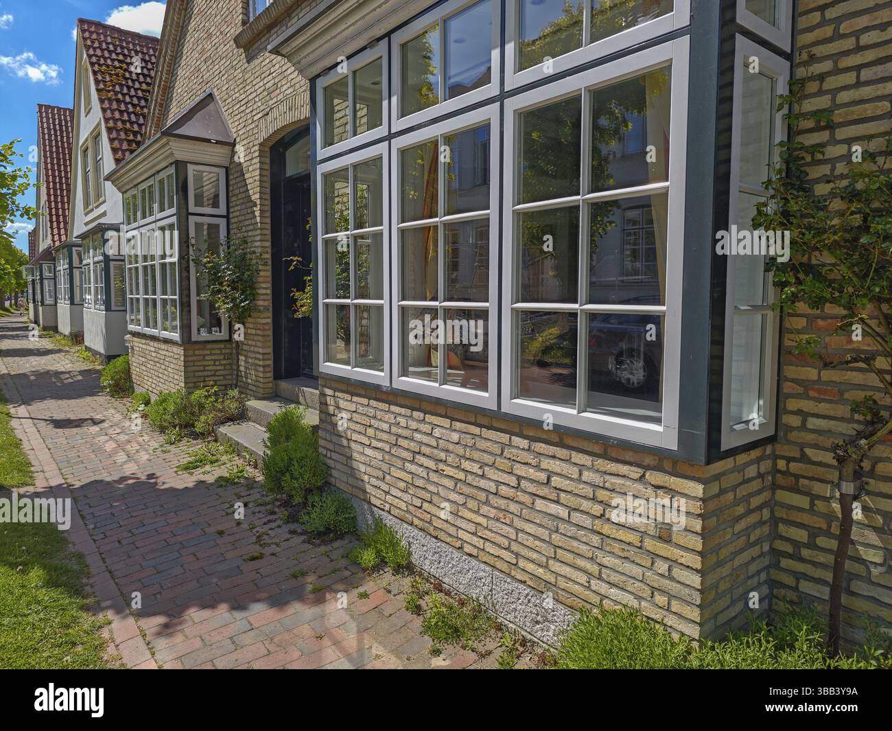 Historic row of houses with bay windows in Lange Strasse, gabled houses ...