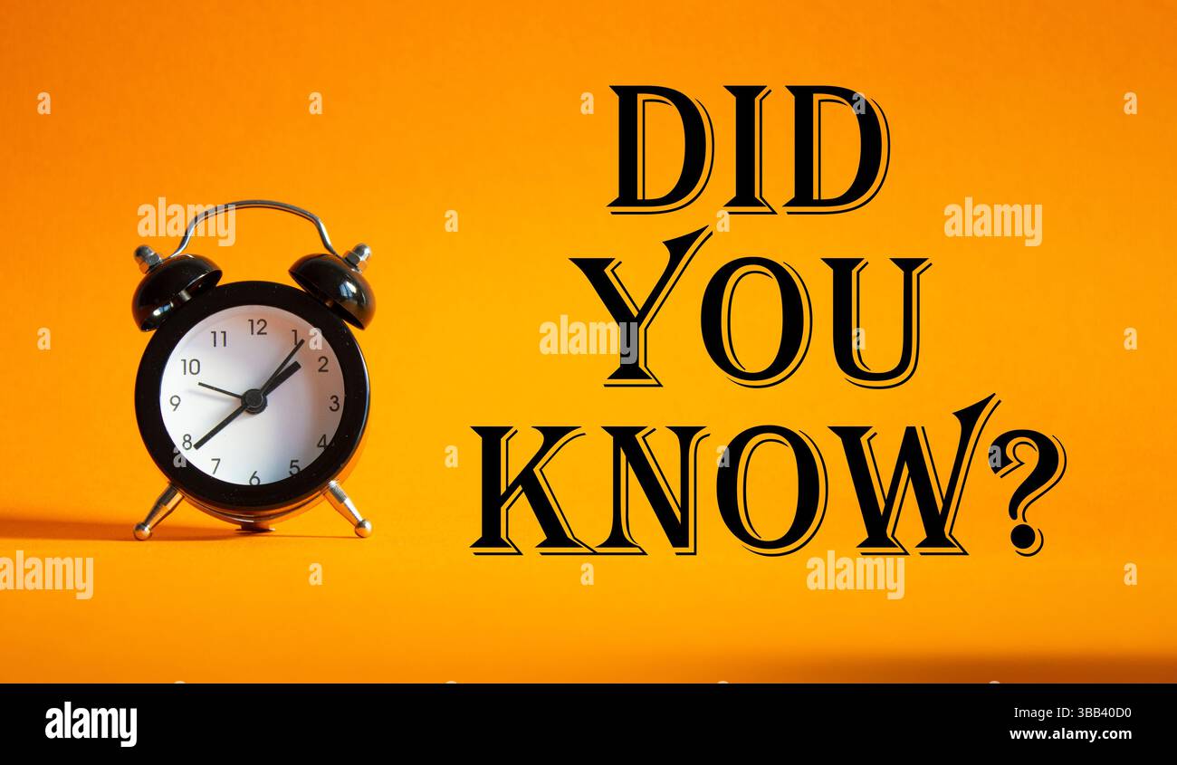 Did you know symbol. Beautiful orange background with alarm clock ...