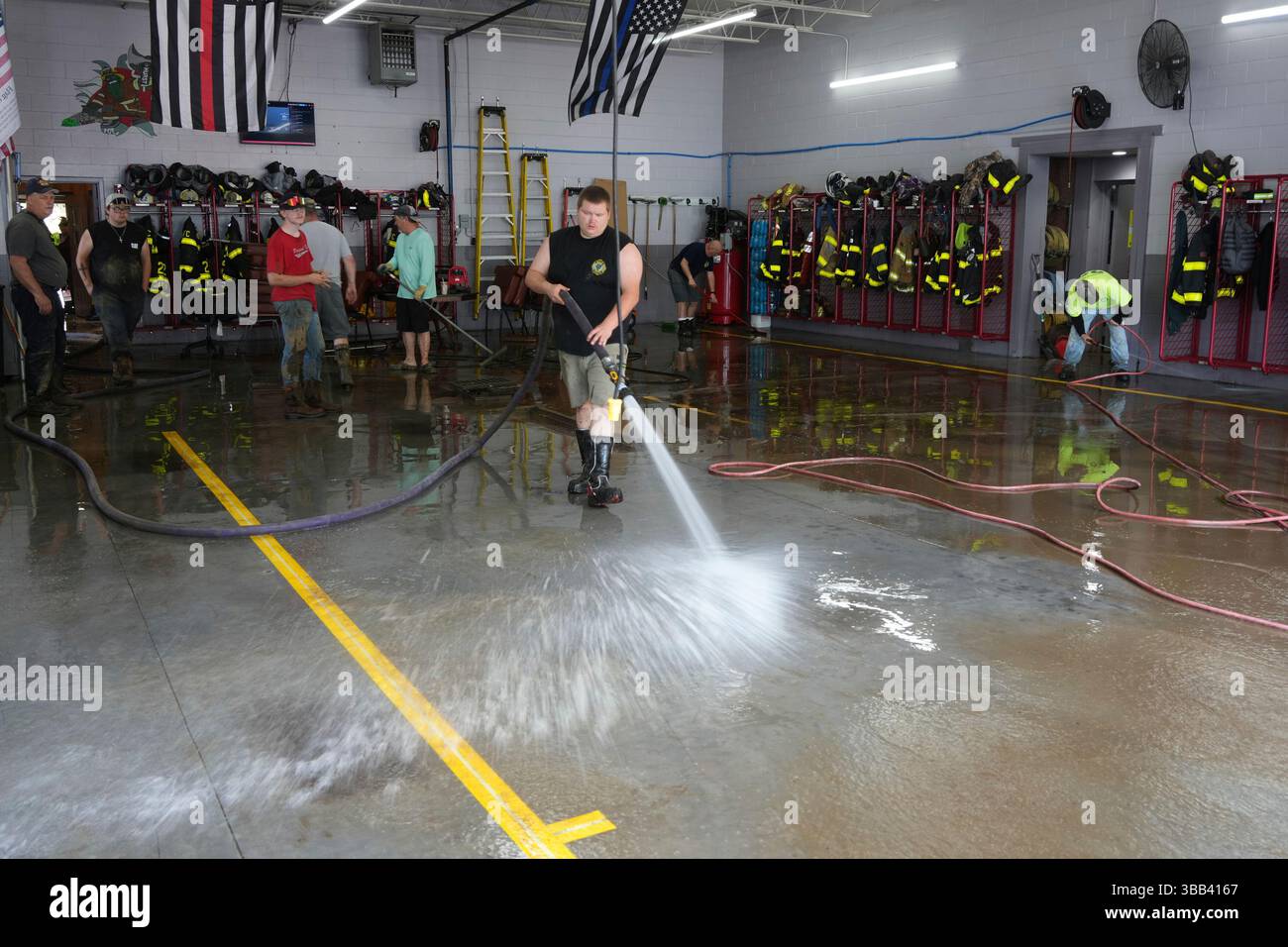 Clean up continues inside the fire station after flooding on Wednesday ...