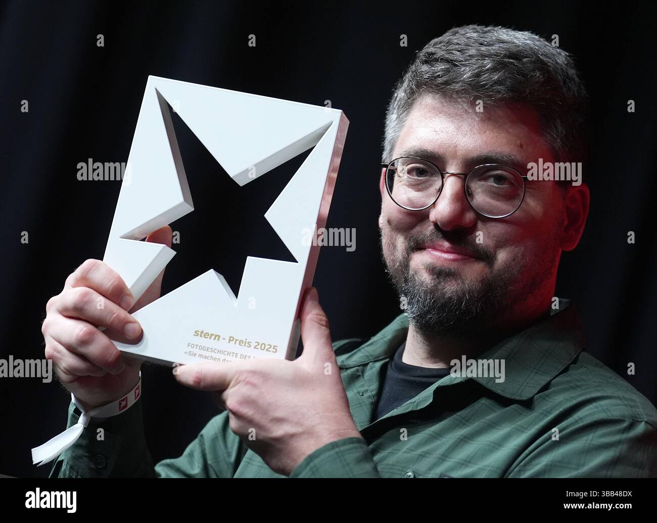 14 May 2025, Hamburg: Swiss photographer Dominic Nahr, winner of the ...