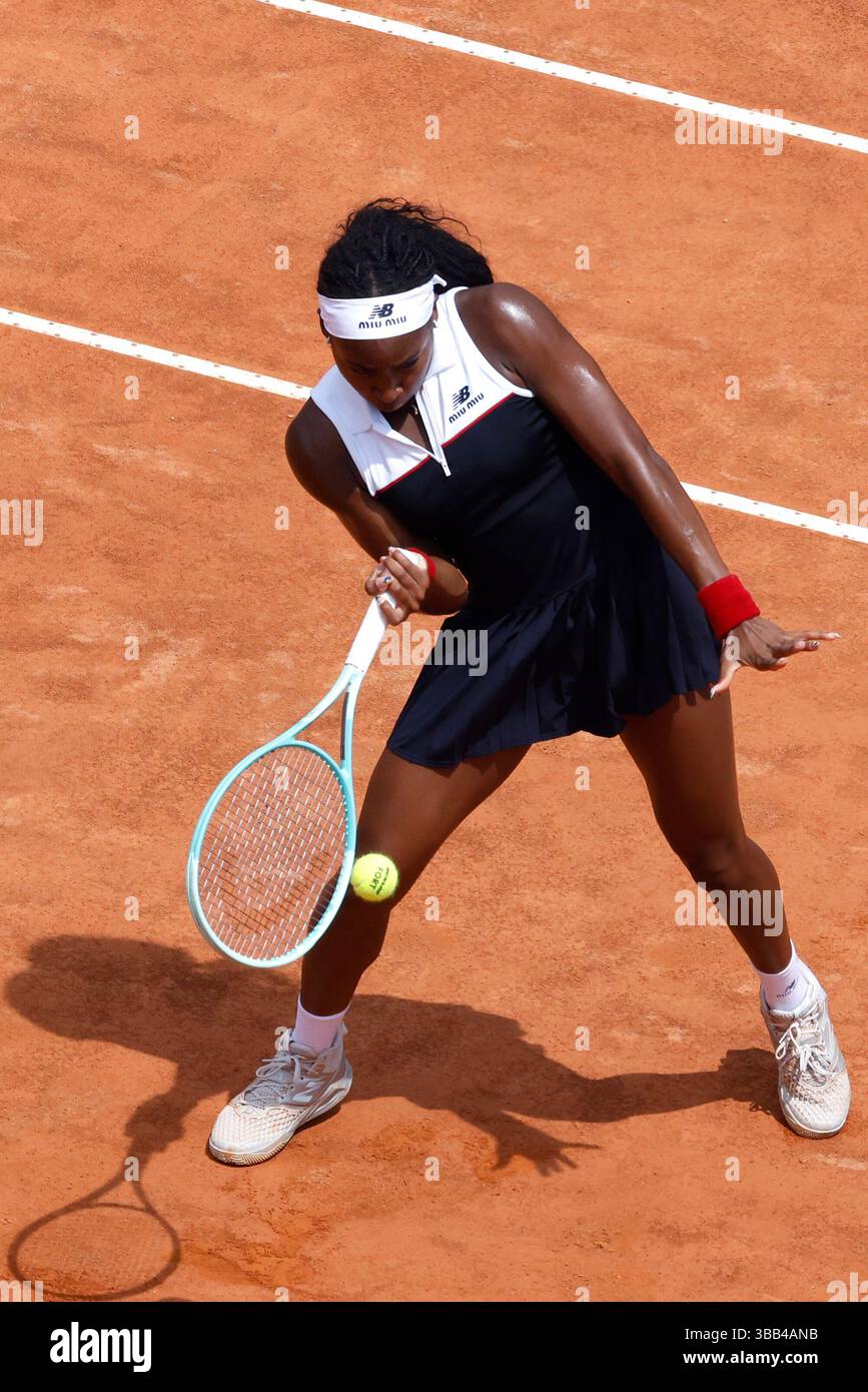 Rome, Italy. 14th May, 2025. Rome, Italy, May 14, 2025. U.S. Coco Gauff returns the ball to ...