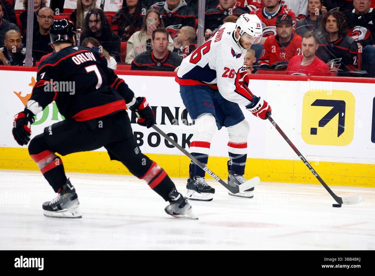 Washington Capitals' Nic Dowd (26) carries the puck past the Carolina ...