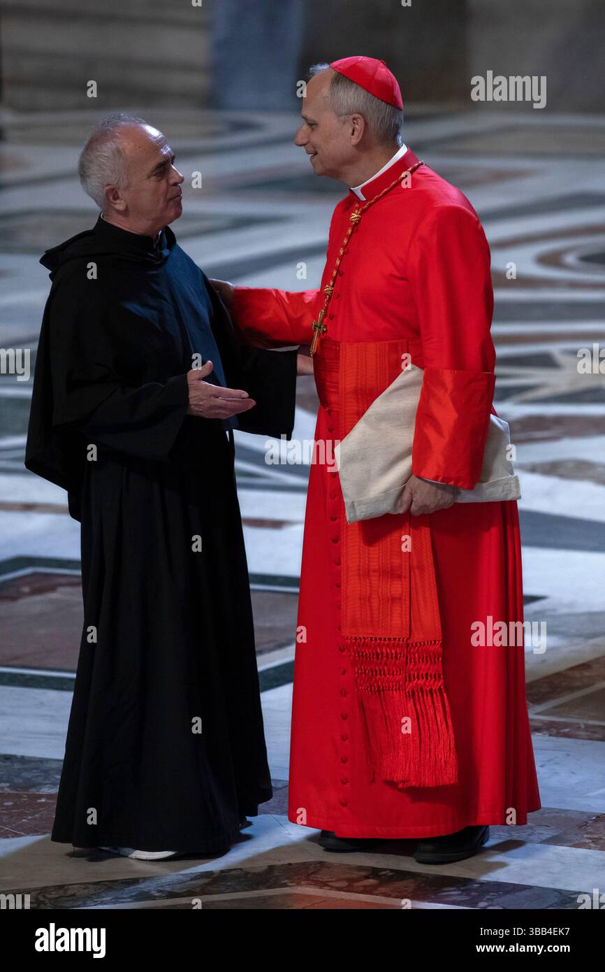 Cardinal Robert Francis Prevost speaks with a priest upon his arrival ...