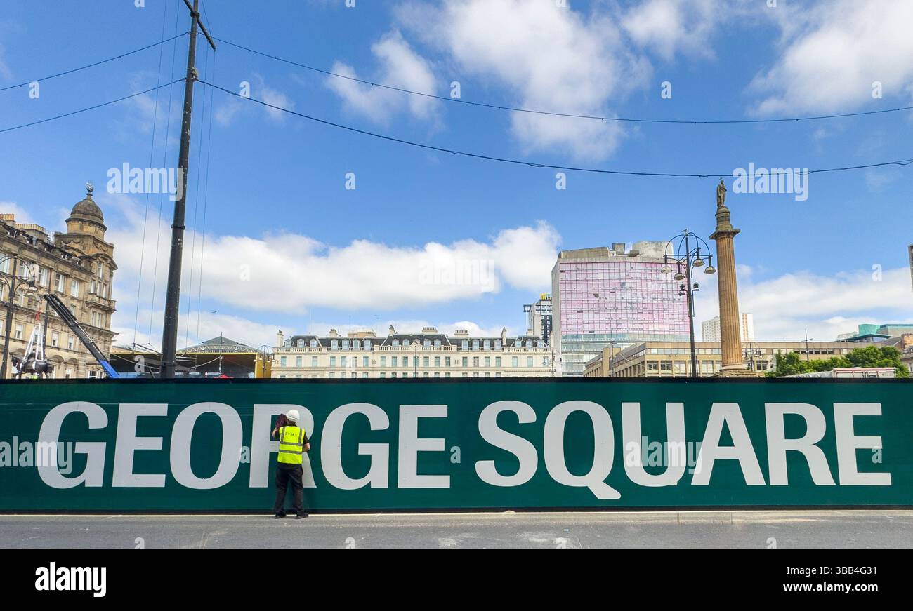 George Square, Glasgow, UK. 14th May, 2025. A worker cleans down the ...