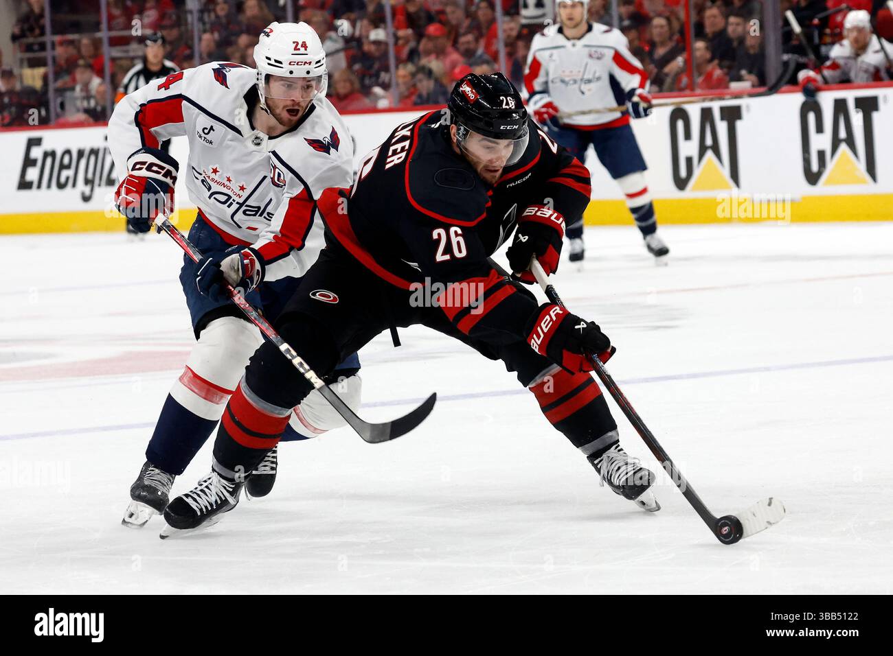 Carolina Hurricanes' Sean Walker (26) controls the puck in front of ...