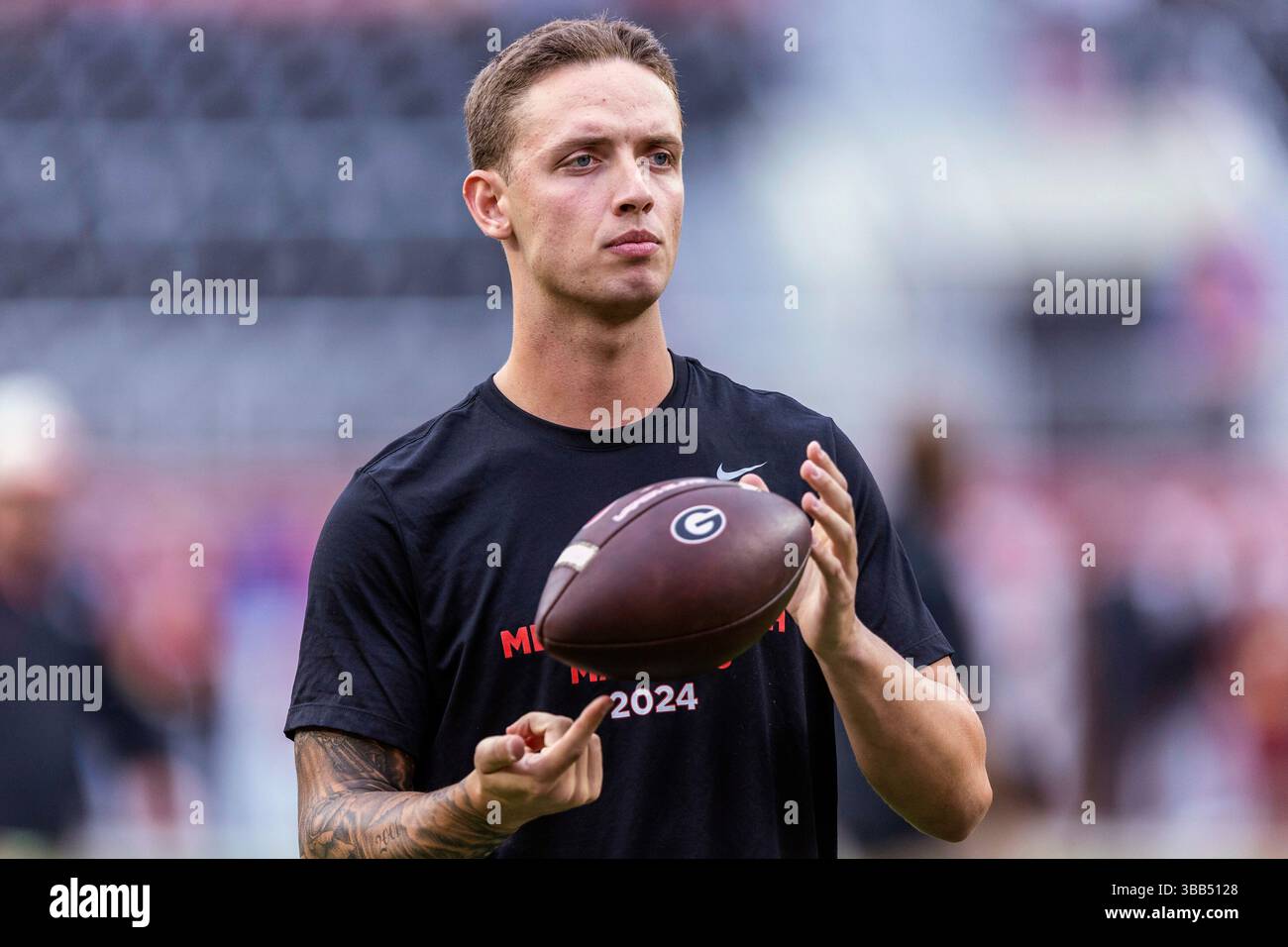 FILE - Then-Georgia quarterback Carson Beck (15) takes the field for ...