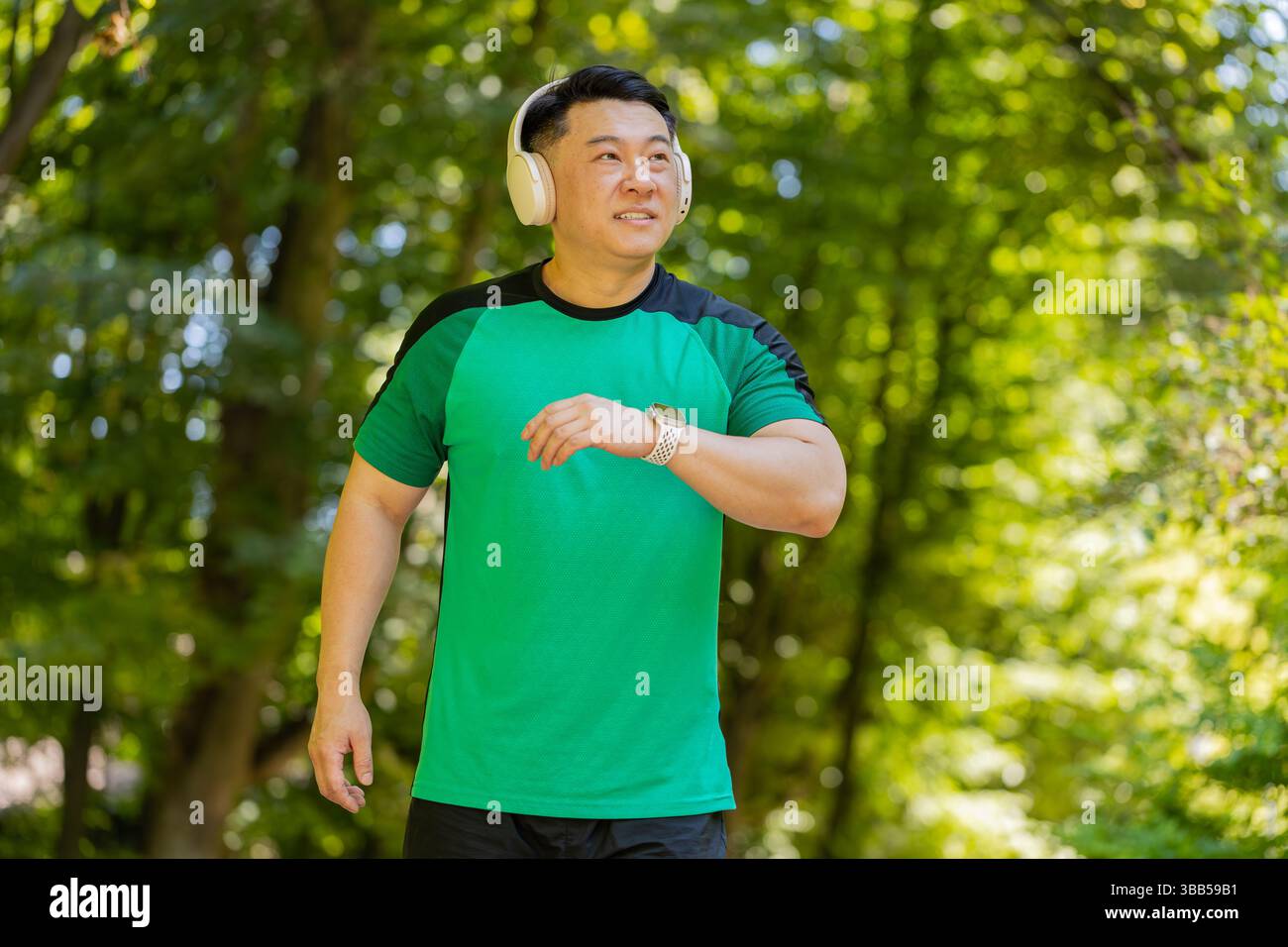 Athletic fitness sport runner man training marathon run, listening ...