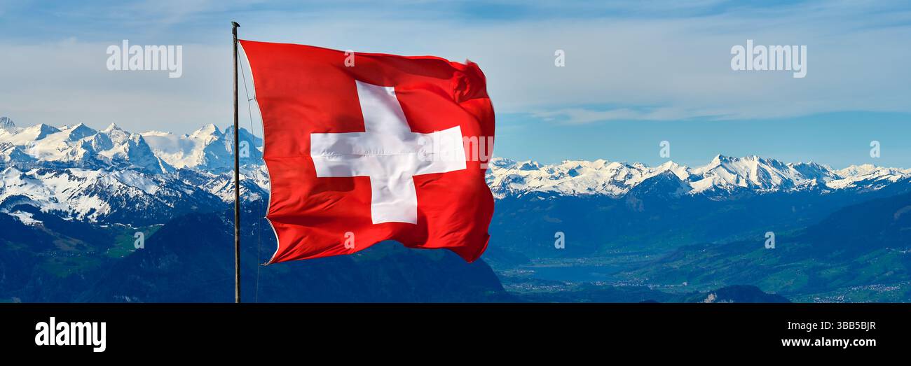 The Swiss flag stands proudly in the foreground, with breathtaking snow ...