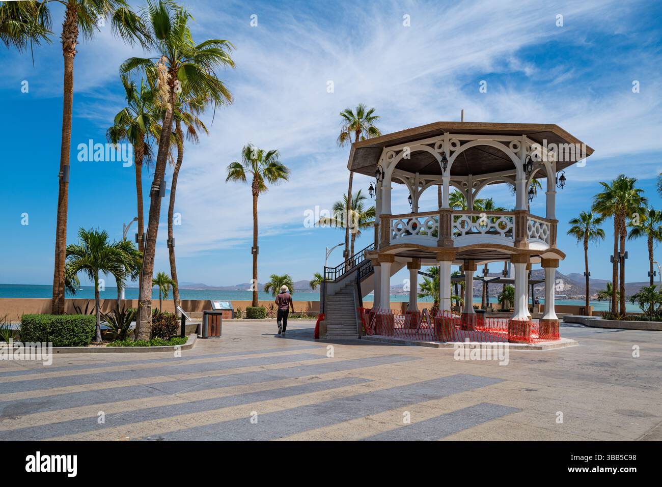 View of the landmark Kiosk with man walking near it on the Malecon ...