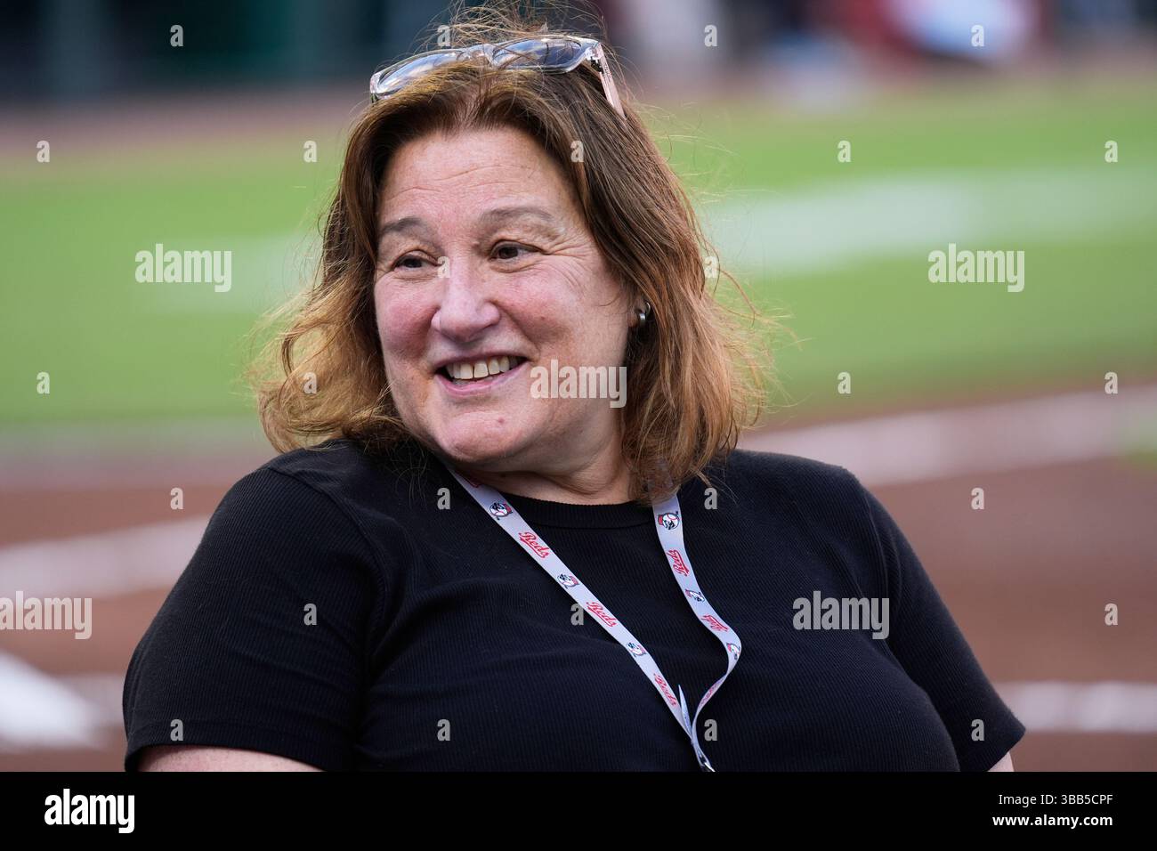 Pete Rose's daughter Fawn Rose smiles as she watches Pete Rose Night events before a baseball ...
