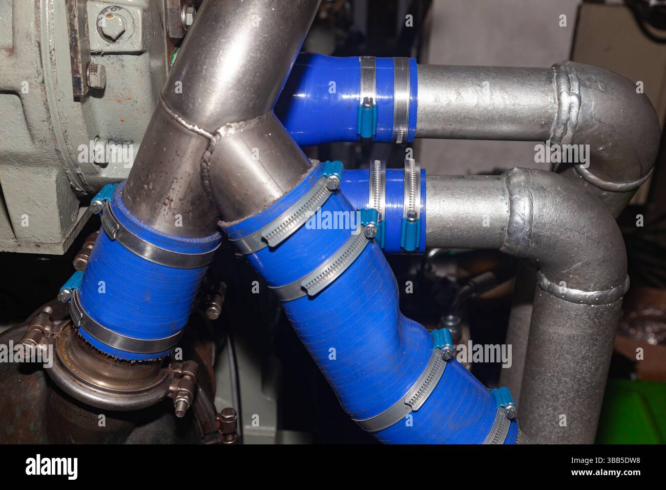 Connecting steel pipes on a marine diesel generator Stock Photo - Alamy