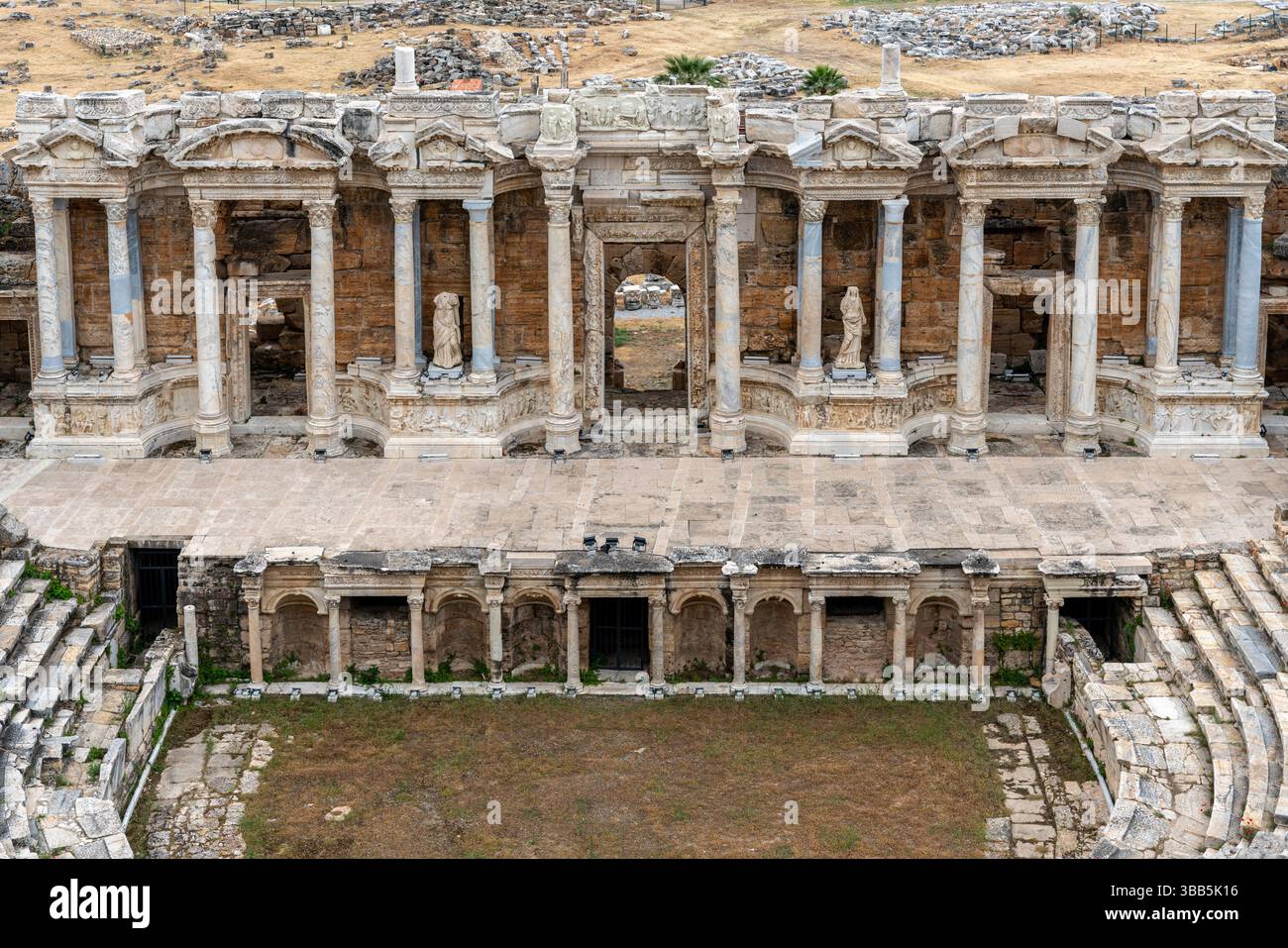 Rows of stone seats curve around the grand Roman theater at Hierapolis ...