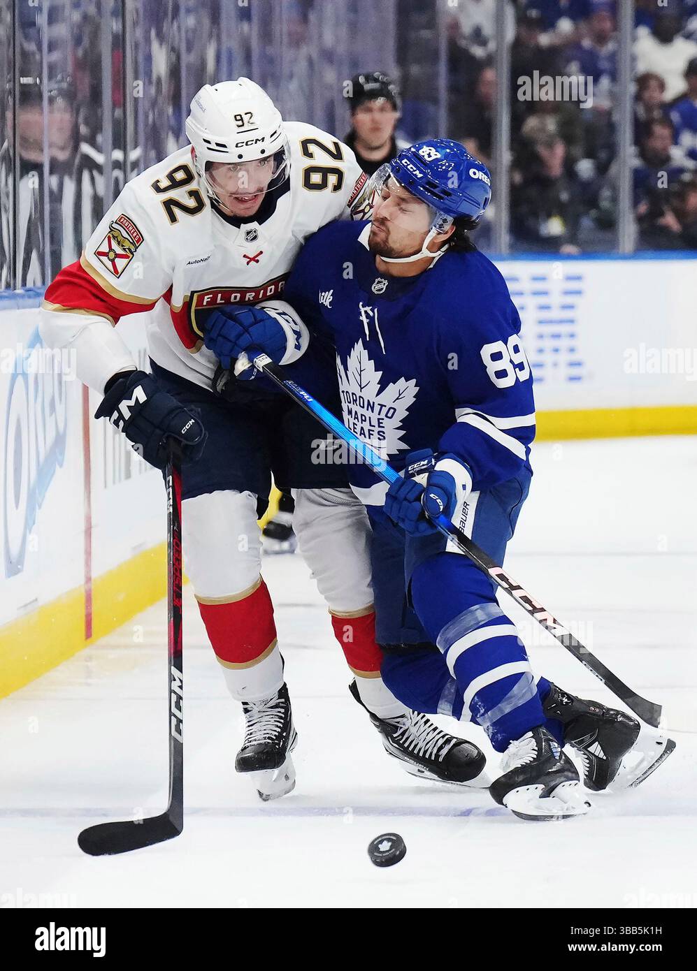Toronto Maple Leafs' Nicholas Robertson (89) checks Florida Panthers ...
