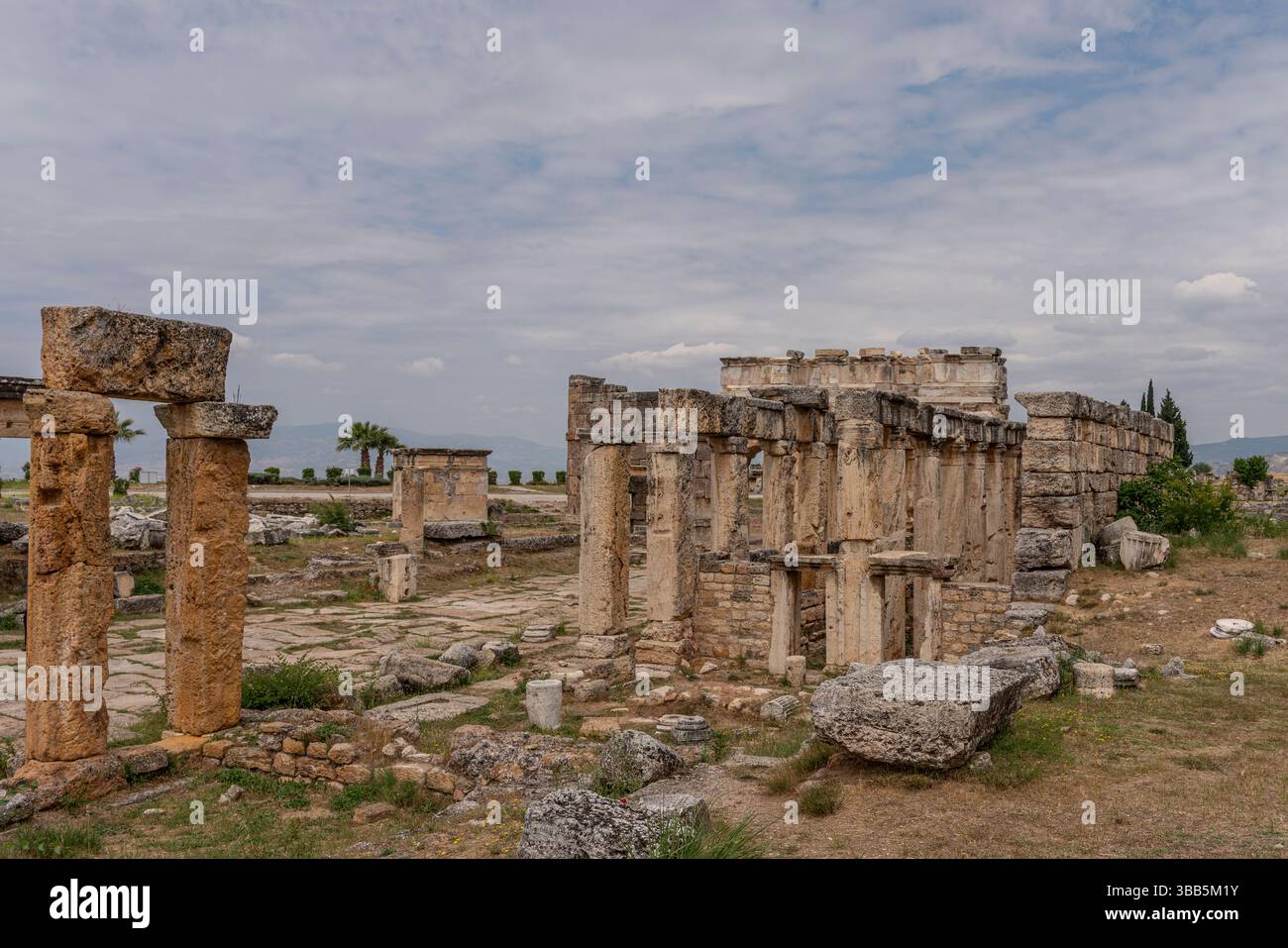 Ruined stone columns and a lintel mark the remains of the ancient ...
