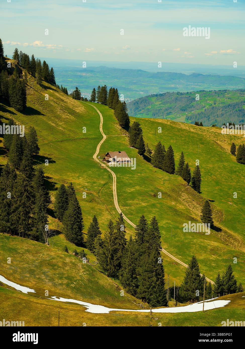 Scenic mountainscape with a rustic cabin surrounded by lush greenery ...