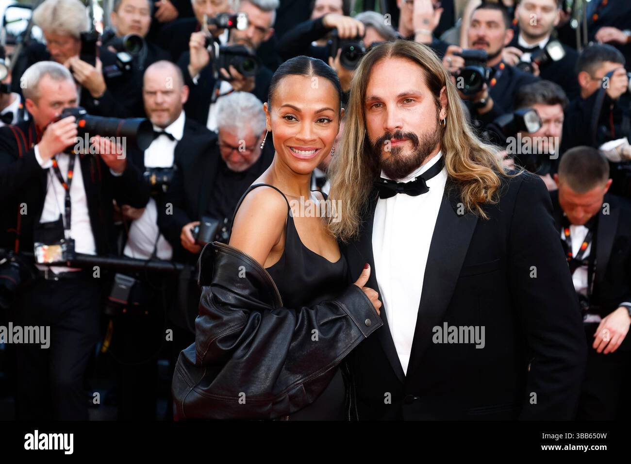Zoe Saldana and Marco Perego attend the premiere of 'Mission Impossible ...