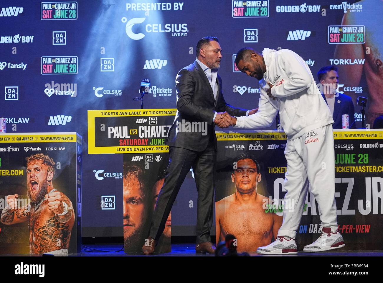 Oscar De La Hoya, CEO of Golden Boy Promotions is greeted by boxer ...