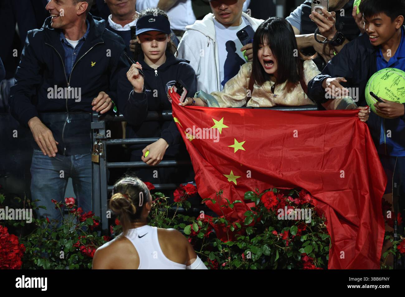 Rome, Italy. 14th May, 2025. Zheng Qinwen reacts with fans after winning the women's singles ...