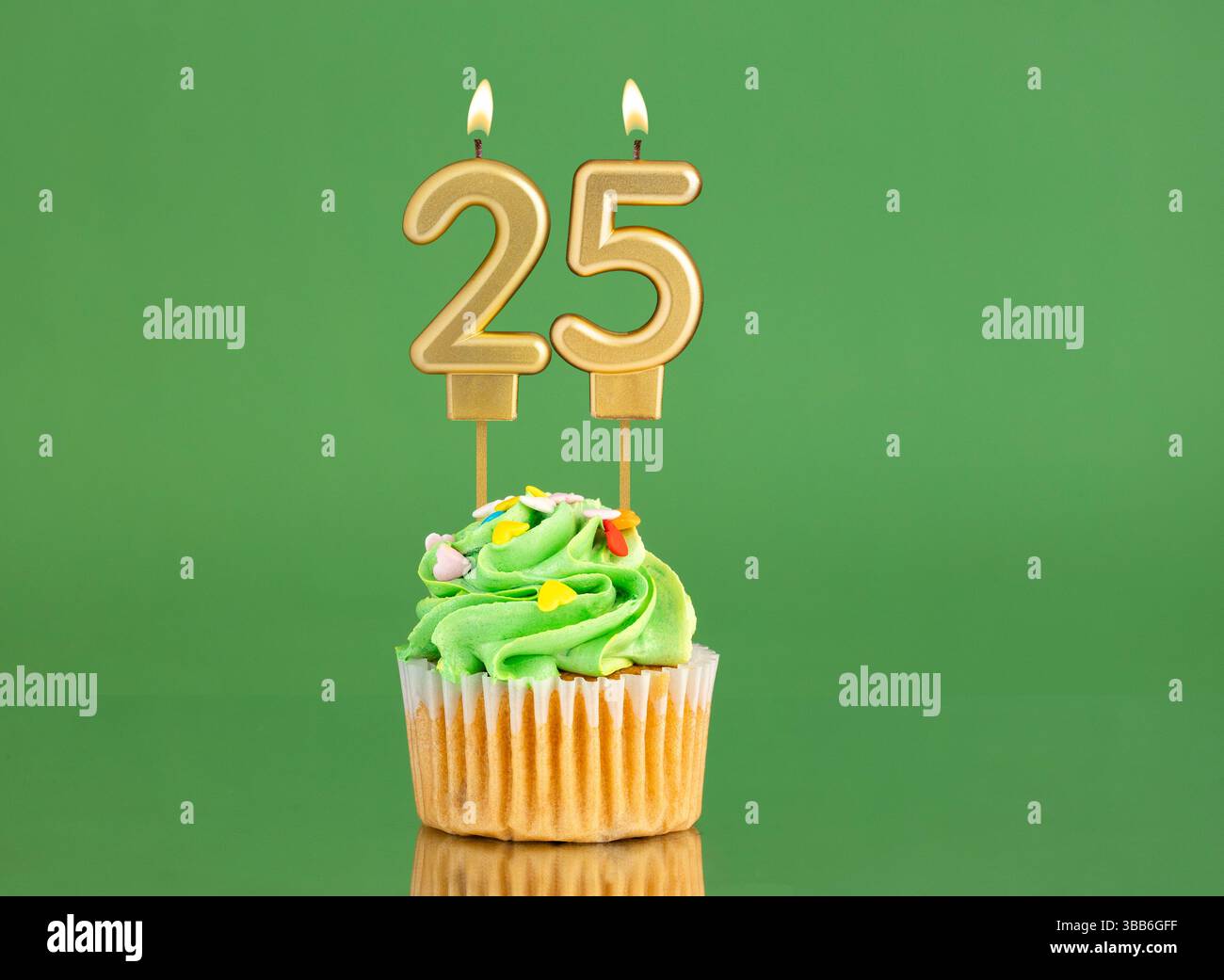 Number 25 birthday candle - Cupcake on a green background Stock Photo ...