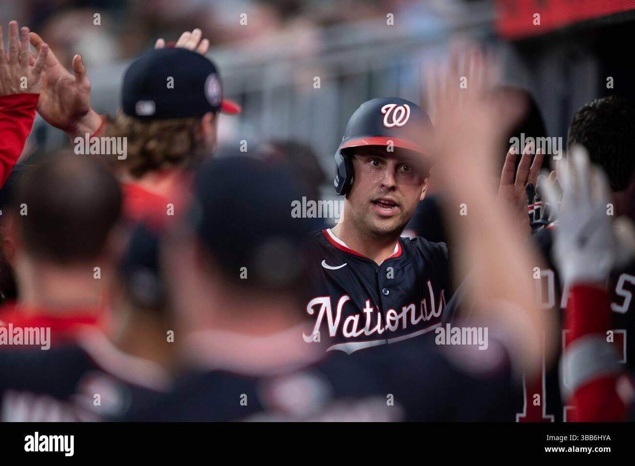 Washington Nationals' Nathaniel Lowe (33) celebrates in the dugout ...